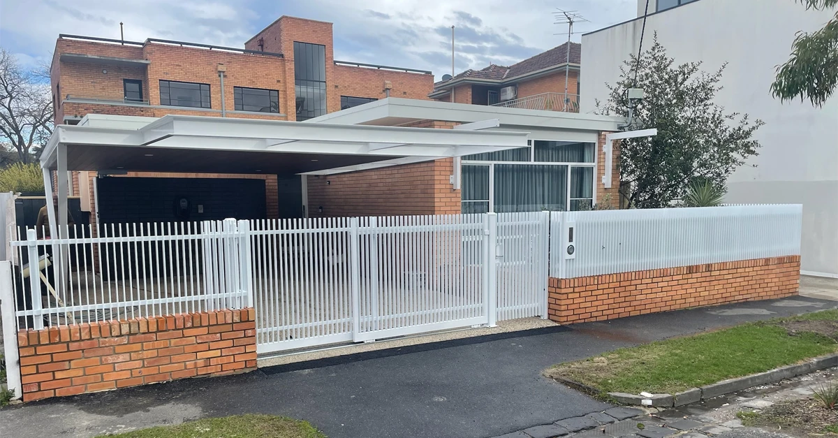 White steel blade fence and telescopic sliding gate | Haven Fencing
